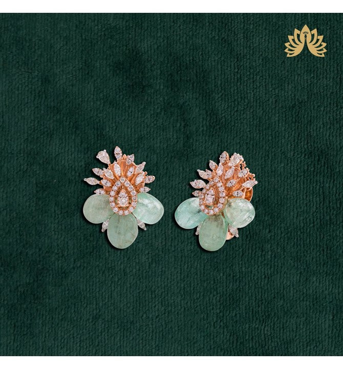 Leaf buds prettily crafted Ear studs using yellow gold with Emerald be ...